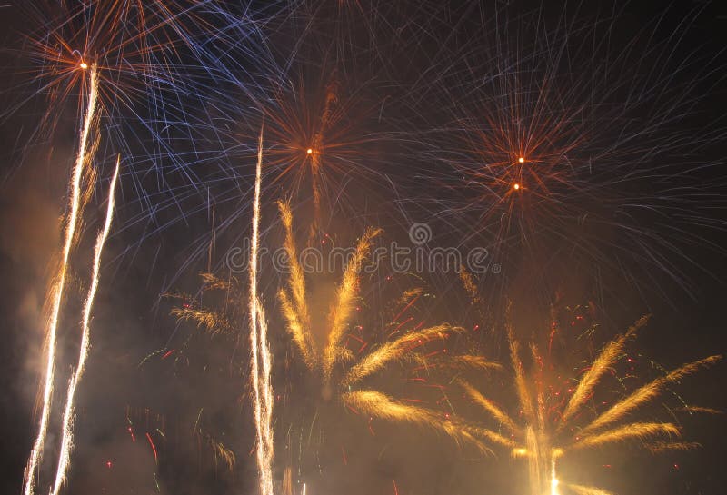 Blue and yellow fireworks stock image. Image of bright - 106898339