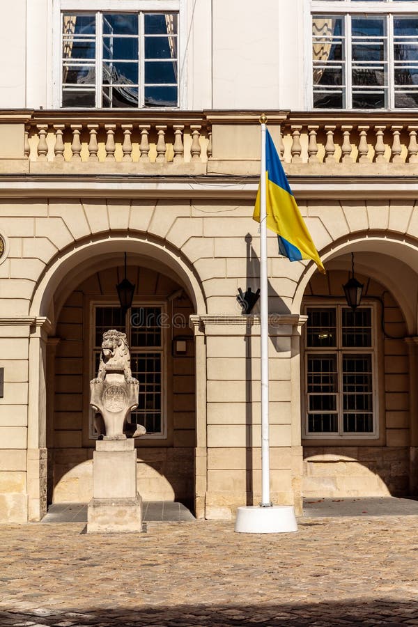 A Blue and Yellow Flag is Flying Outside of a Building Stock Photo ...