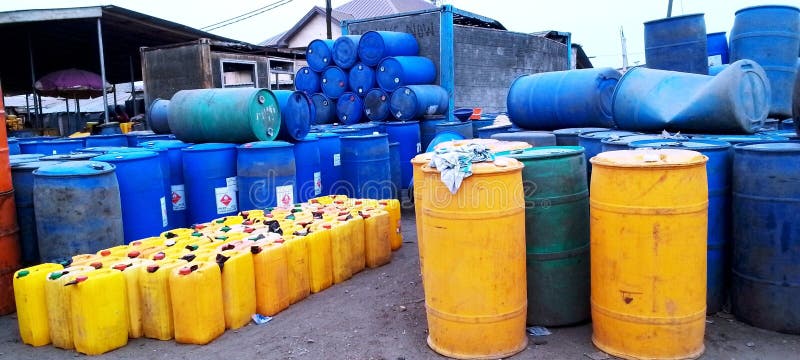 Blue and Yellow Oil Barrel Container Drums in Junk Yard Editorial Stock ...