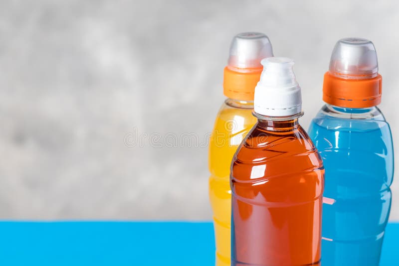 Blue, Yellow and Orange Isotonic Drinks. with Copyspace Stock Photo ...