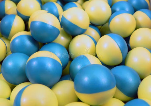 Blue and Yellow Paintballs stock image. Image of close - 425549