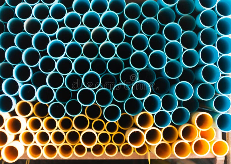 Blue and Yellow PVC Water Pipes in the Warehouse Stock Photo - Image of ...