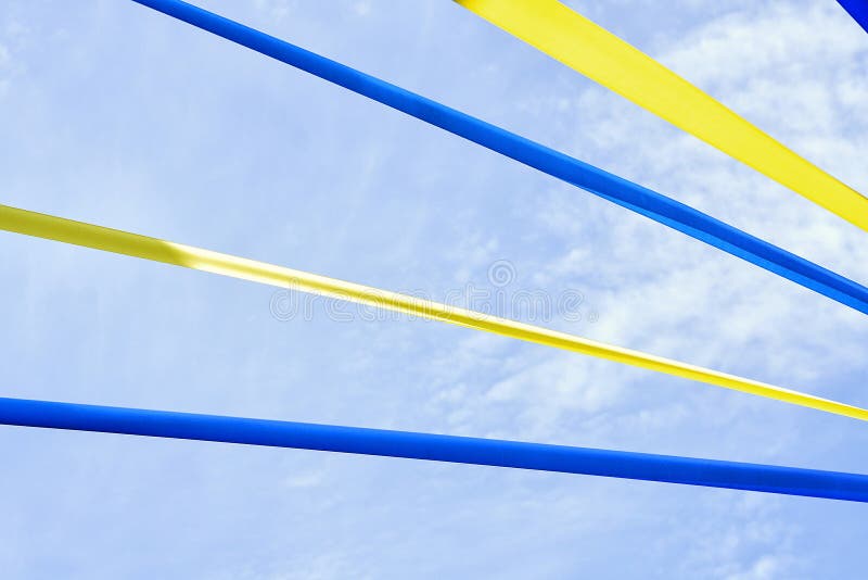 Blue and Yellow Ribbons on the Sky Background Stock Image - Image of ...