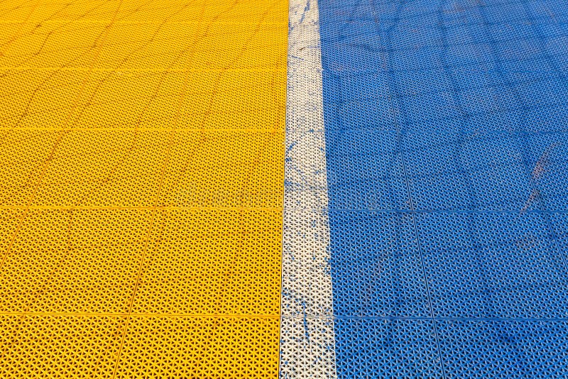 Blue and Yellow Rubber Flooring on Futsal Field Background Stock Photo ...
