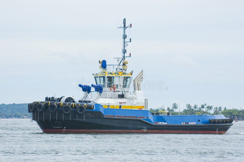 Blue and yellow tugboat 2 stock photo. Image of house - 16372822