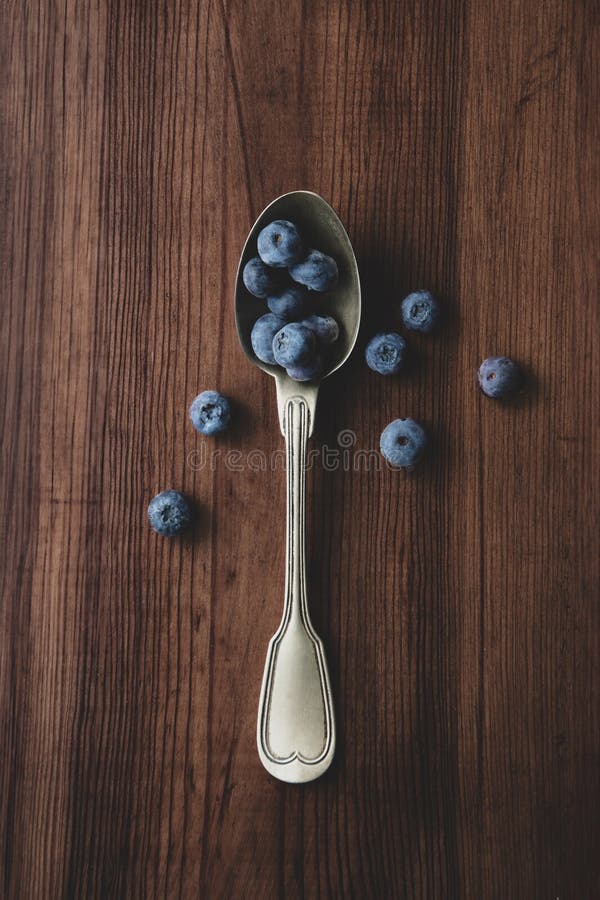Blueberries Along with a Spoon on a Wood Table Stock Image - Image of ...