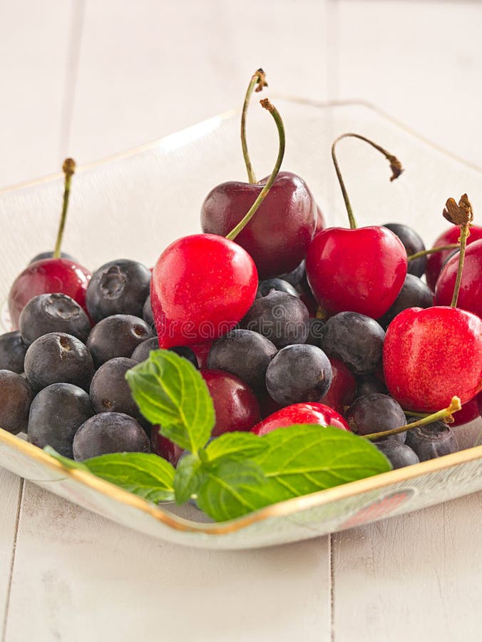 Blueberries and cherries stock photo. Image of bowl, ripe - 31480836