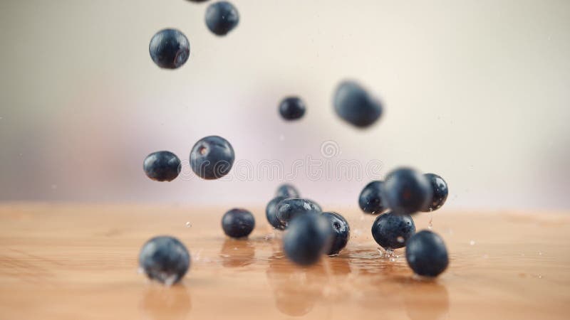 Blueberries Falling Onto the Wooden Cutting Board Bouncing and ...