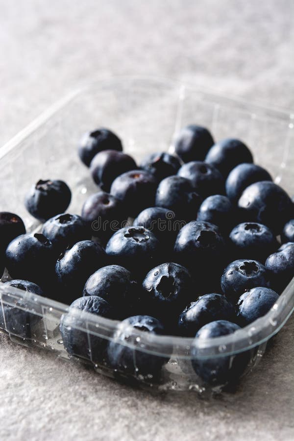 Blueberries on gray stone stock image. Image of stone - 90284135
