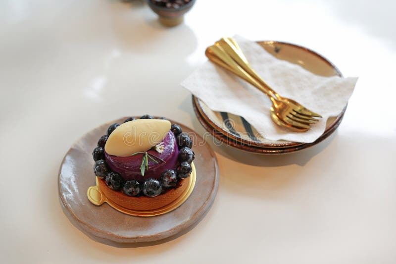 Blueberry Cheesecake Cake in Plate on Table at the CAFE Stock Photo ...