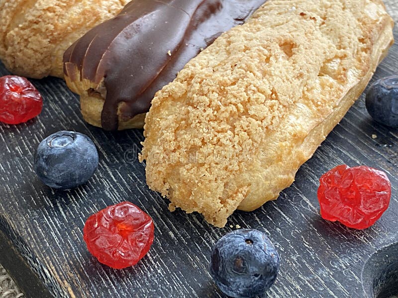 Blueberry Eclairs on a Dark Blue Background Stock Photo - Image of ...