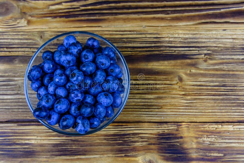 Blueberry in Glass Bowl on a Wooden Table. Top View Stock Photo - Image ...