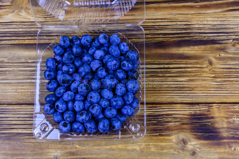 Blueberry in Plastic Box on a Wooden Table. Top View Stock Photo ...