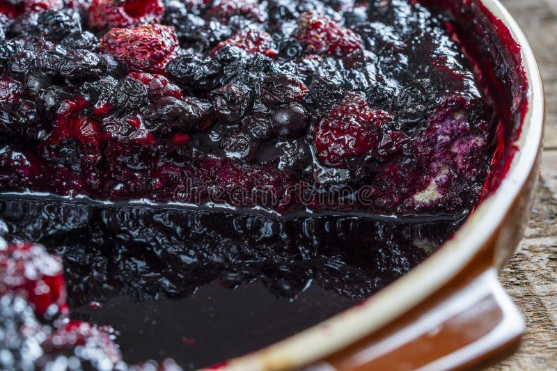 Blueberry and Raspberry Pie in a Ceramic Dish on the Table, Closeup ...