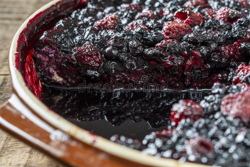 Blueberry and Raspberry Pie in a Ceramic Dish on the Table, Closeup ...