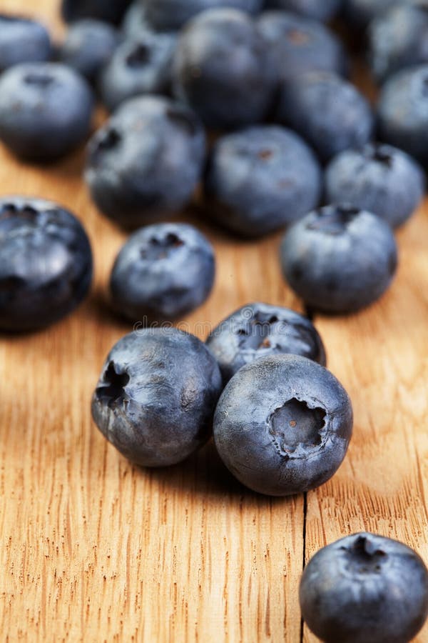 Blueberry on wooden table stock image. Image of bilberry - 57518709