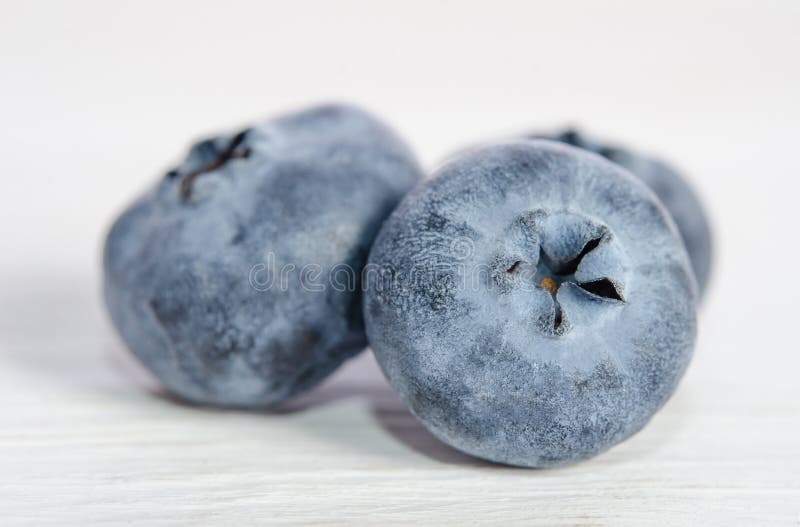 Blueberry on wooden table stock image. Image of studio - 84831961
