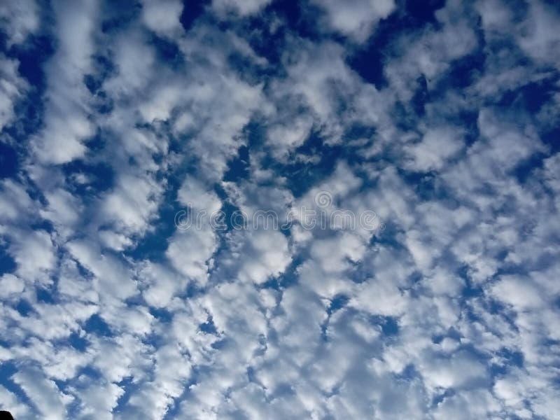 Blueish Sky and Wave Like Clouds Stock Photo - Image of clouds, wave ...