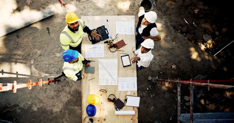 Blueprint, Construction and People at Table with Layout, Discussion or ...