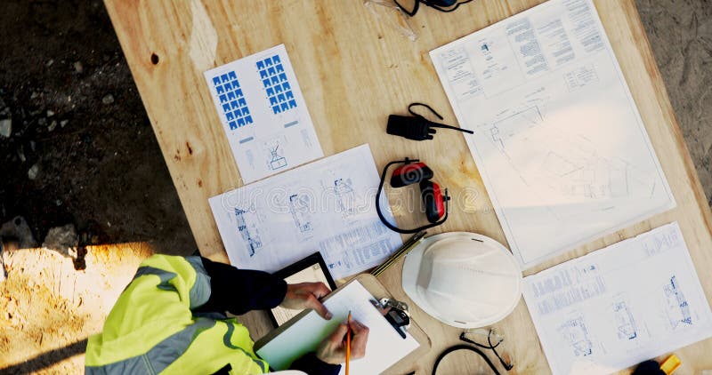 Blueprint, Construction and Person at Table with Layout, Checklist and ...