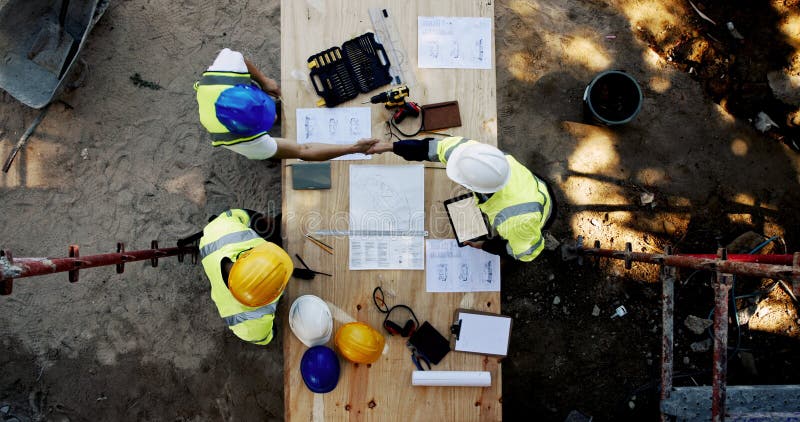Blueprint, Construction Site and Men at Table with Handshake ...