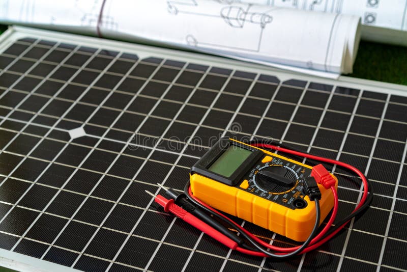 Blueprint Roll and Solar Panel, Home Project Stock Photo - Image of ...