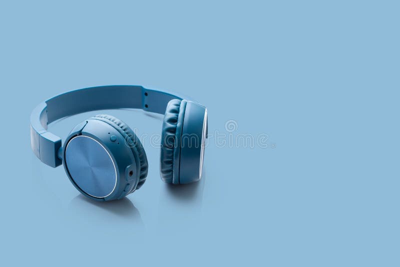 Bluetooth Blue Headphone on Blue Background Stock Photo - Image of ...