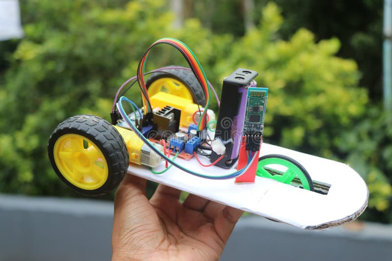Bluetooth Controlled Robot Car Held in the Hand on a Natural Background ...