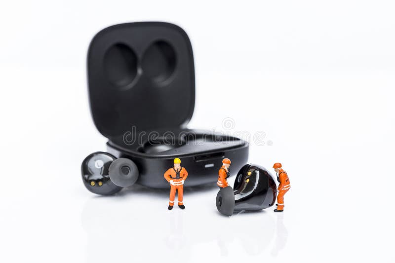 Bluetooth Earbuds with Miniature Worker Isolate on White Background ...