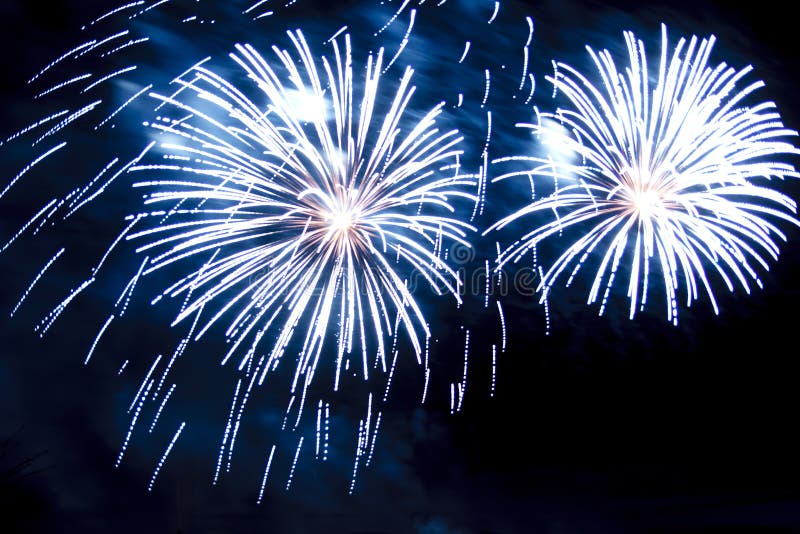 Bluish Sparks of Bright Fireworks in the Night Sky Stock Photo - Image ...