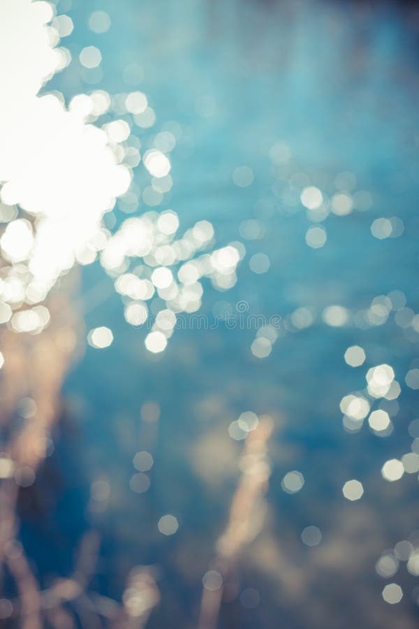 Blur Bokeh Background of Water with Flecks of Sunlight Stock Image ...