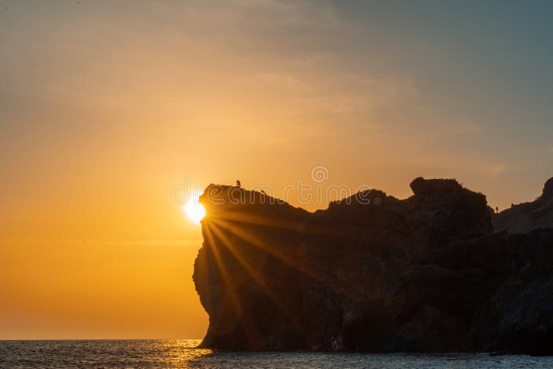 In Blur an Epic Sunset on the Sea - the Sun Sets Behind the Mountain ...