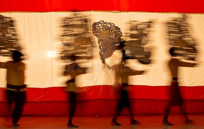 Blur Image of Four Player Men Moving with Perform Grand Shadow Play in ...