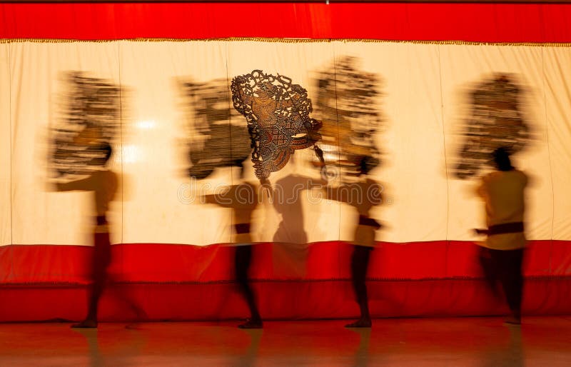 Blur Image of Four Player Men Moving with Perform Grand Shadow Play in ...