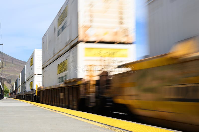 Blur of Intermodal Container Stacked Freight Train Passing in Closeup ...
