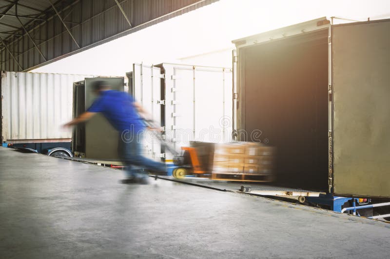 Workers Unloading Packaging Boxes on Pallet in Distribution Warehouse ...