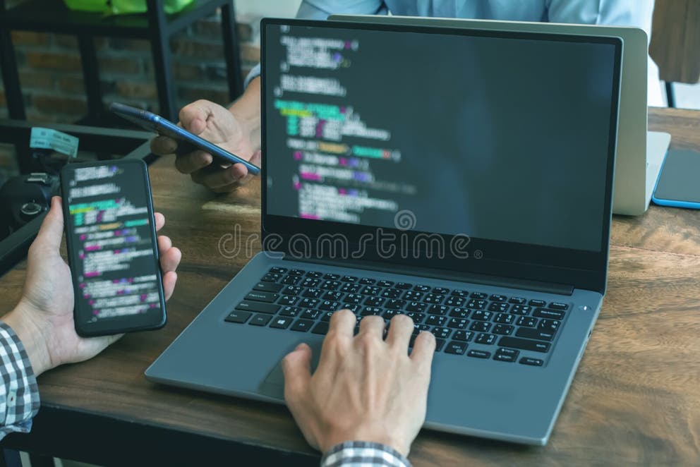 Blur Soft Focus Group Developer Programming and Coding Technology Smartphone and Computer ...