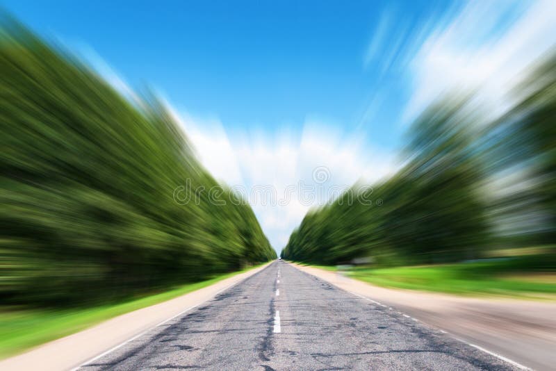 Blurred Asphalt Road and Blue Motion Blurred Sky with Clouds and Stock ...