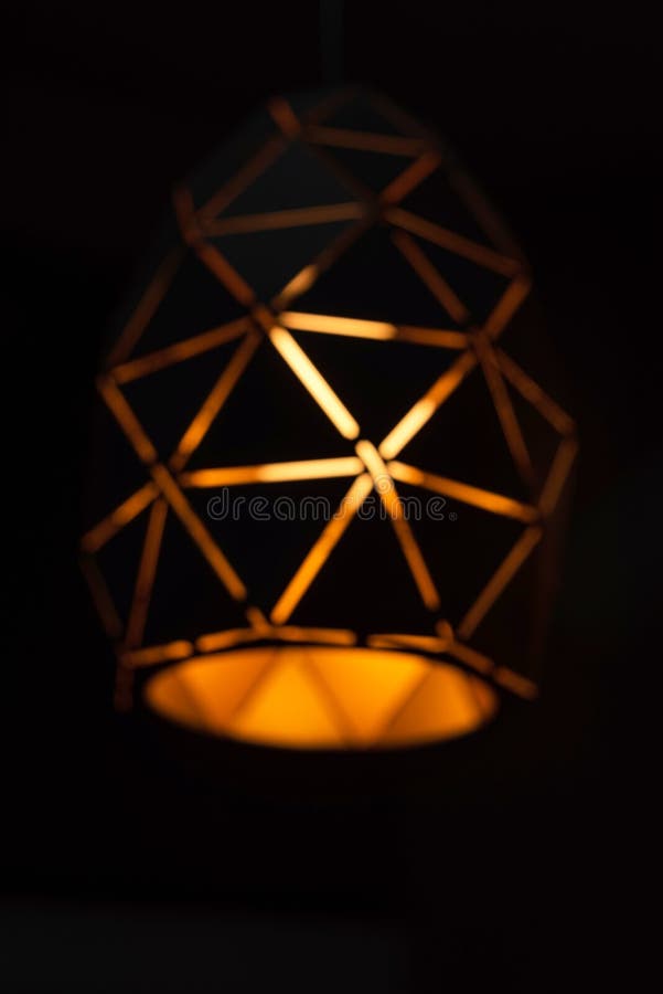A Blurred Background of Black Lamps with a Geometric Pattern, Three ...
