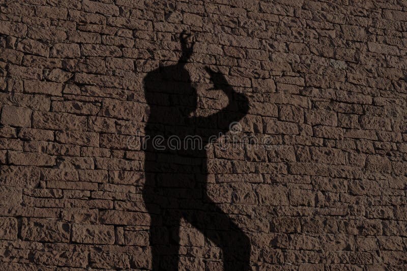 Blurred Black Shadow of a Child with Raised Hands in a Pleading Gesture ...