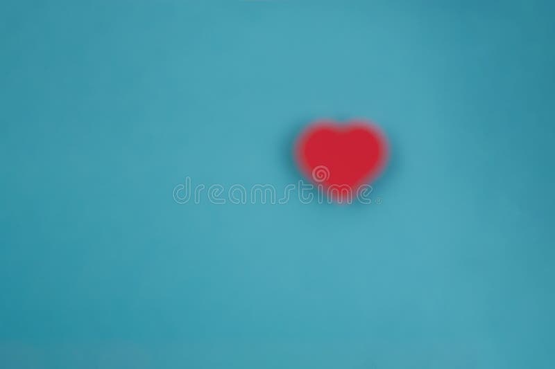 Blurred Blue Background with Blurred Red Heart Stock Image - Image of ...