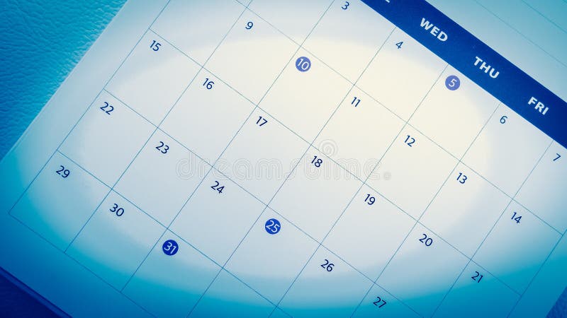 Blurred calendar on blue. stock photo. Image of reminder - 153354556