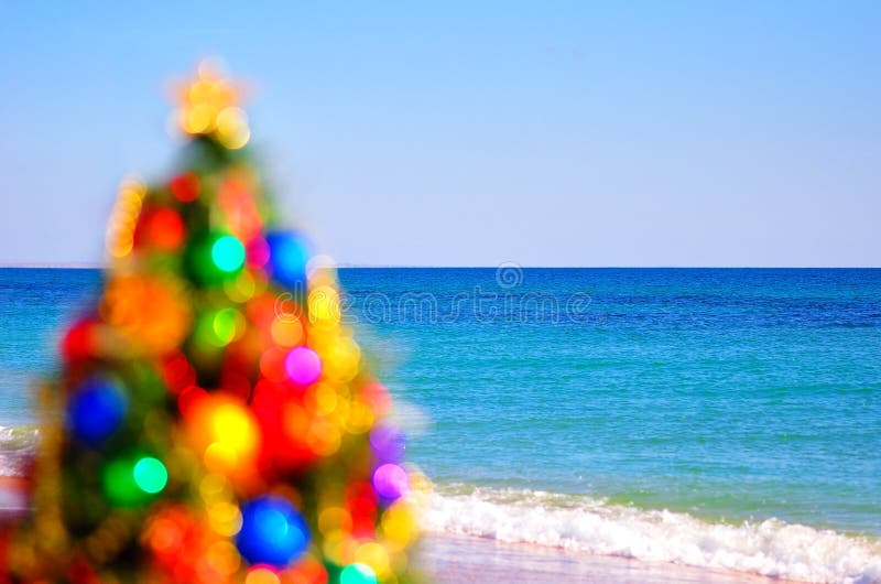 Christmas Tree on Sand in the Beach Stock Photo - Image of colored ...