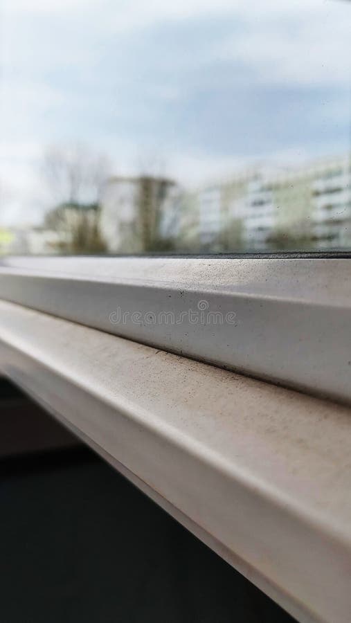 Blurred Cityscape through a Window, Focusing on the Window Frame Stock ...