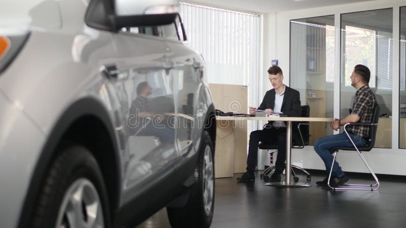 Blurred Customer and Seller Behind a Car Stock Footage - Video of ...