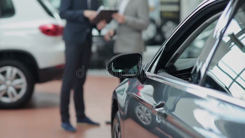 Blurred Customer and Seller Behind a Car Stock Video - Video of ...