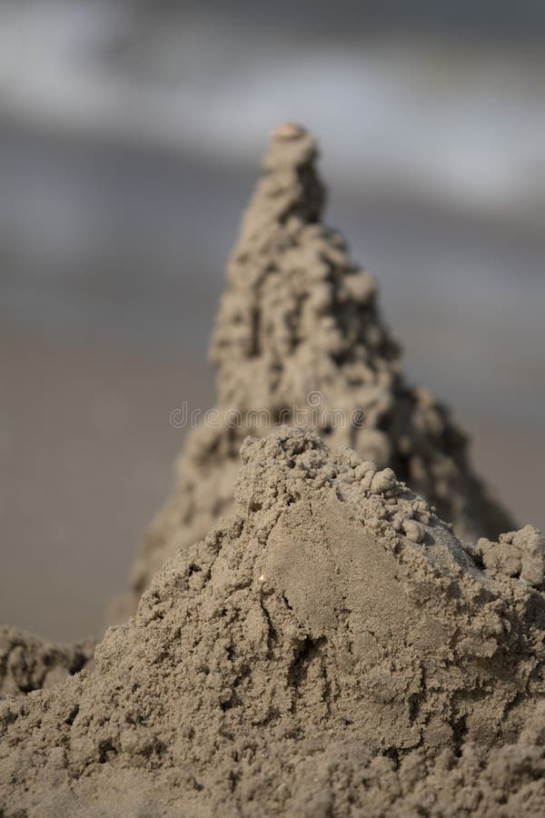 Blurred Dark Sand Tower on the Beach Stock Photo - Image of meditation ...