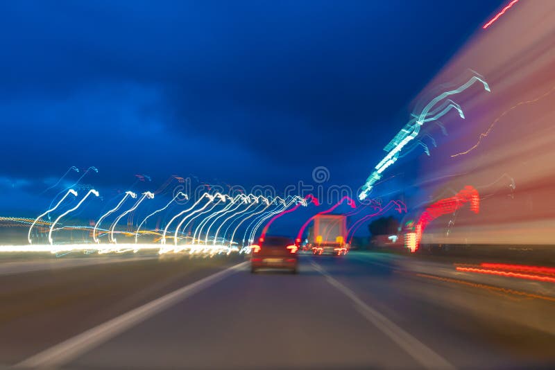 Blurred Defocused Lights of Heavy Traffic on a Wet Rainy. Traffic ...