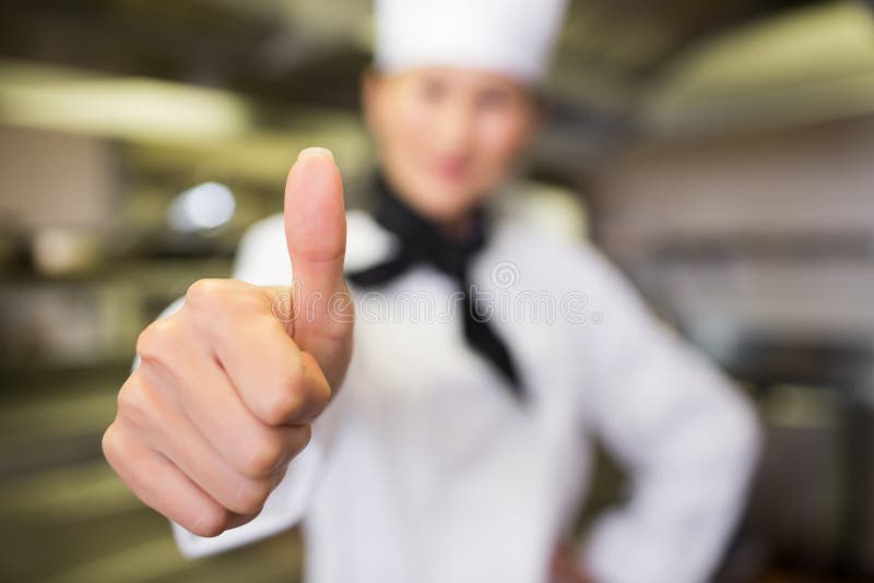 Blurred Female Cook Gesturing Thumbs Up in Kitchen Stock Image - Image ...