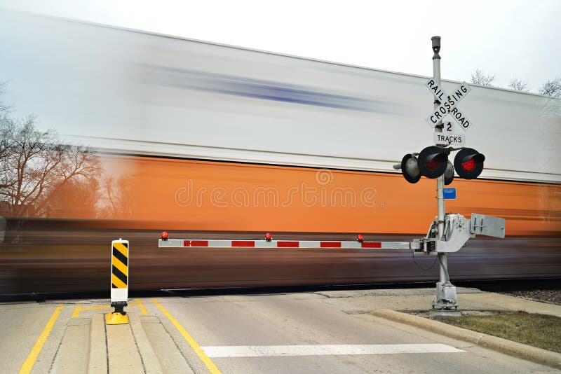 Freight Train in Motion at Crossing Gate Stock Image - Image of speed ...